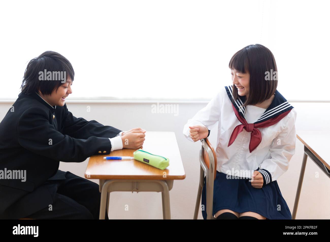Junior high school students playing with their fingers Stock Photo - Alamy