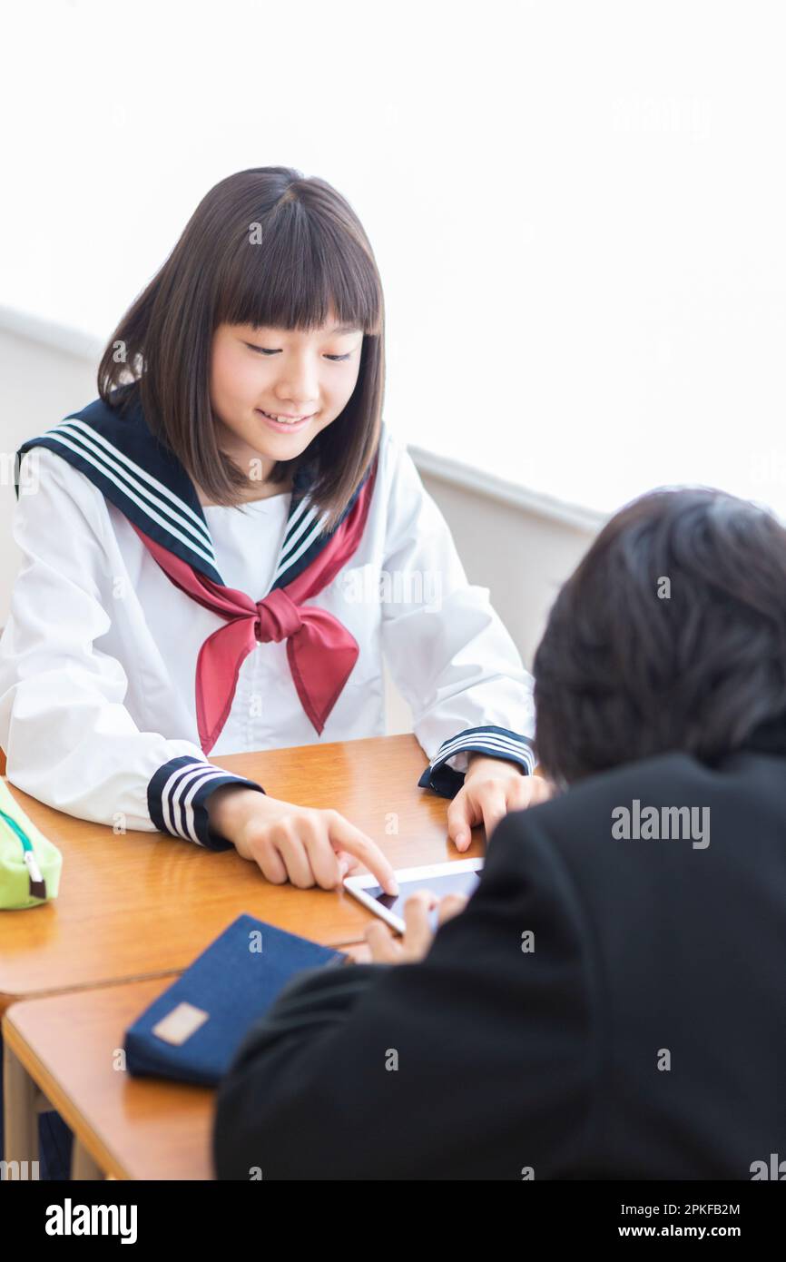A junior high school student playing with a tablet Stock Photo - Alamy