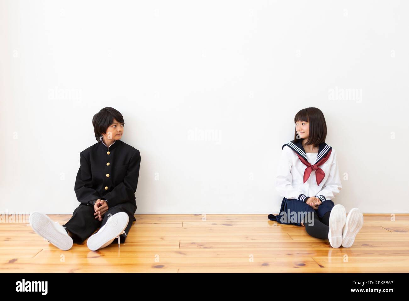 Junior high school students sitting on the floor Stock Photo - Alamy