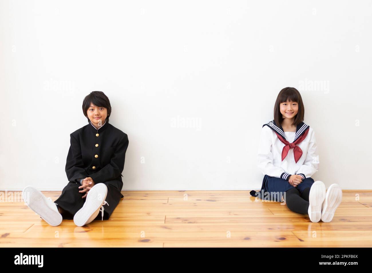 Junior high school students sitting on the floor Stock Photo - Alamy