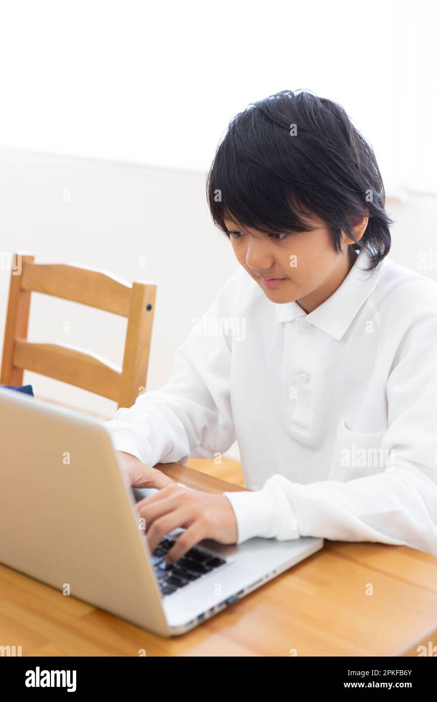 Junior high school students touching a PC Stock Photo - Alamy