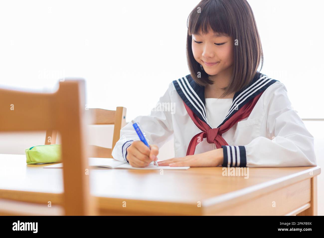 Junior high school students studying at home Stock Photo - Alamy
