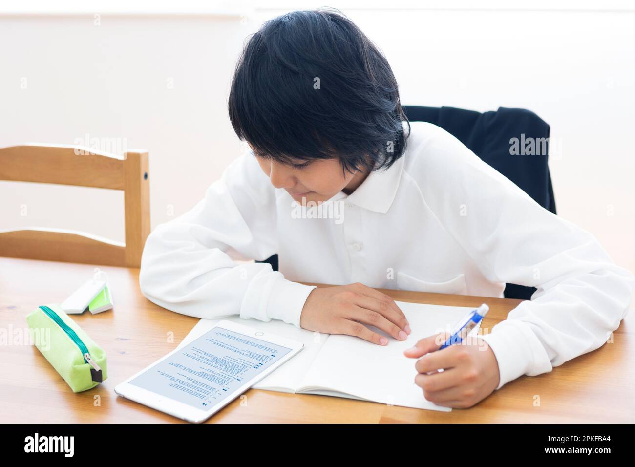 Junior high school students studying at home Stock Photo - Alamy