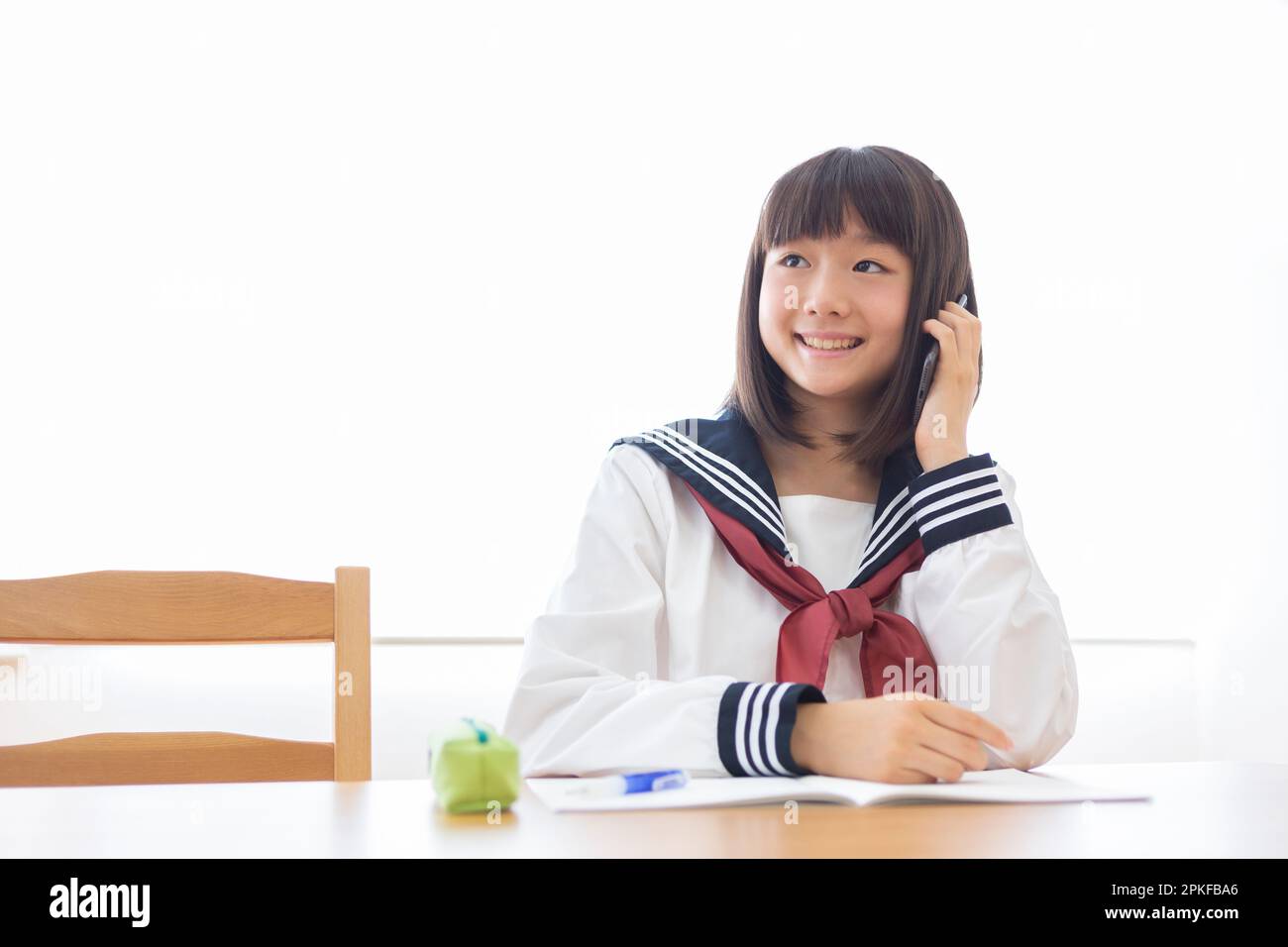 Junior high school students making a phone call Stock Photo - Alamy