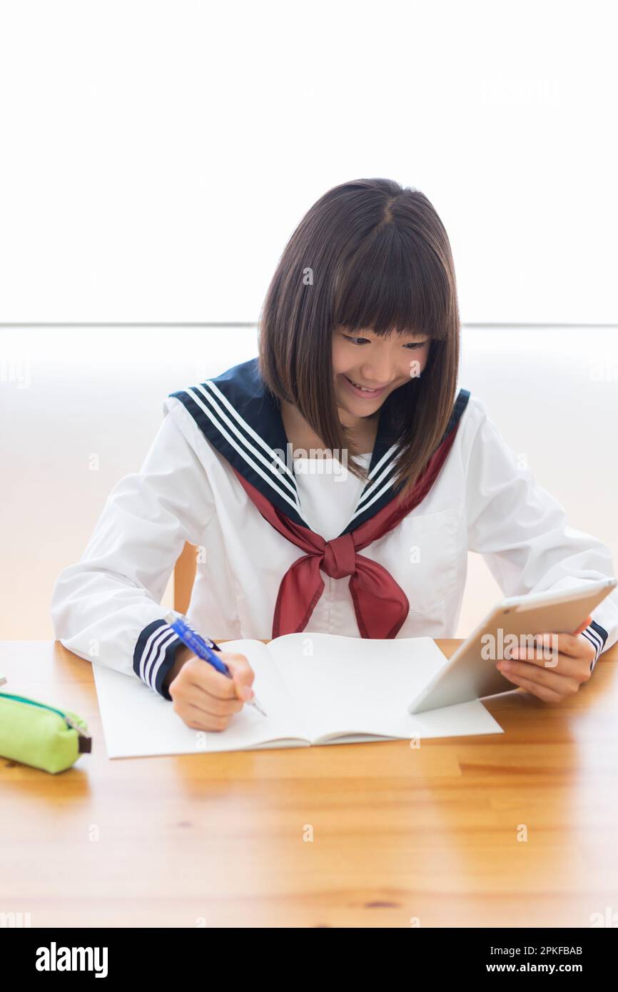 Junior high school students studying at home Stock Photo - Alamy Junior high school students studying at home Stock Photo - Alamy