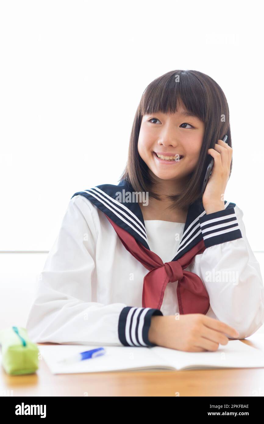 Junior high school students making a phone call Stock Photo - Alamy