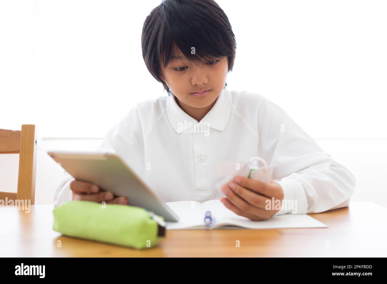 Junior high school students studying at home Stock Photo - Alamy Junior high school students studying at home Stock Photo - Alamy