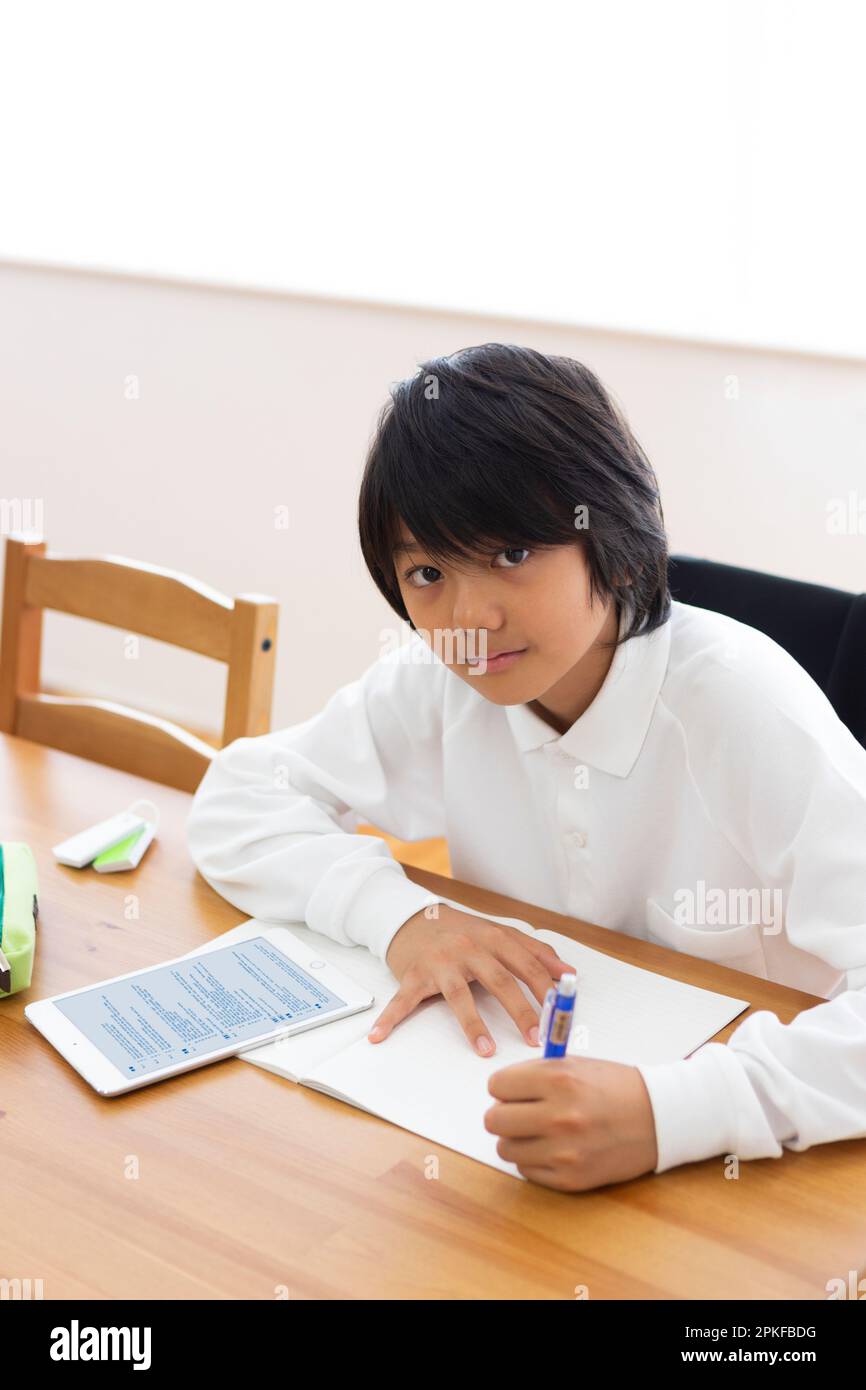 Junior high school students studying at home Stock Photo - Alamy