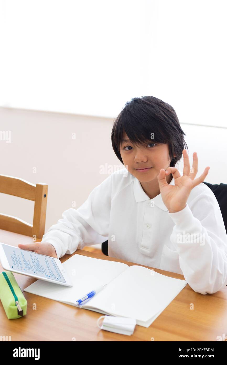 Junior high school students studying at home Stock Photo - Alamy