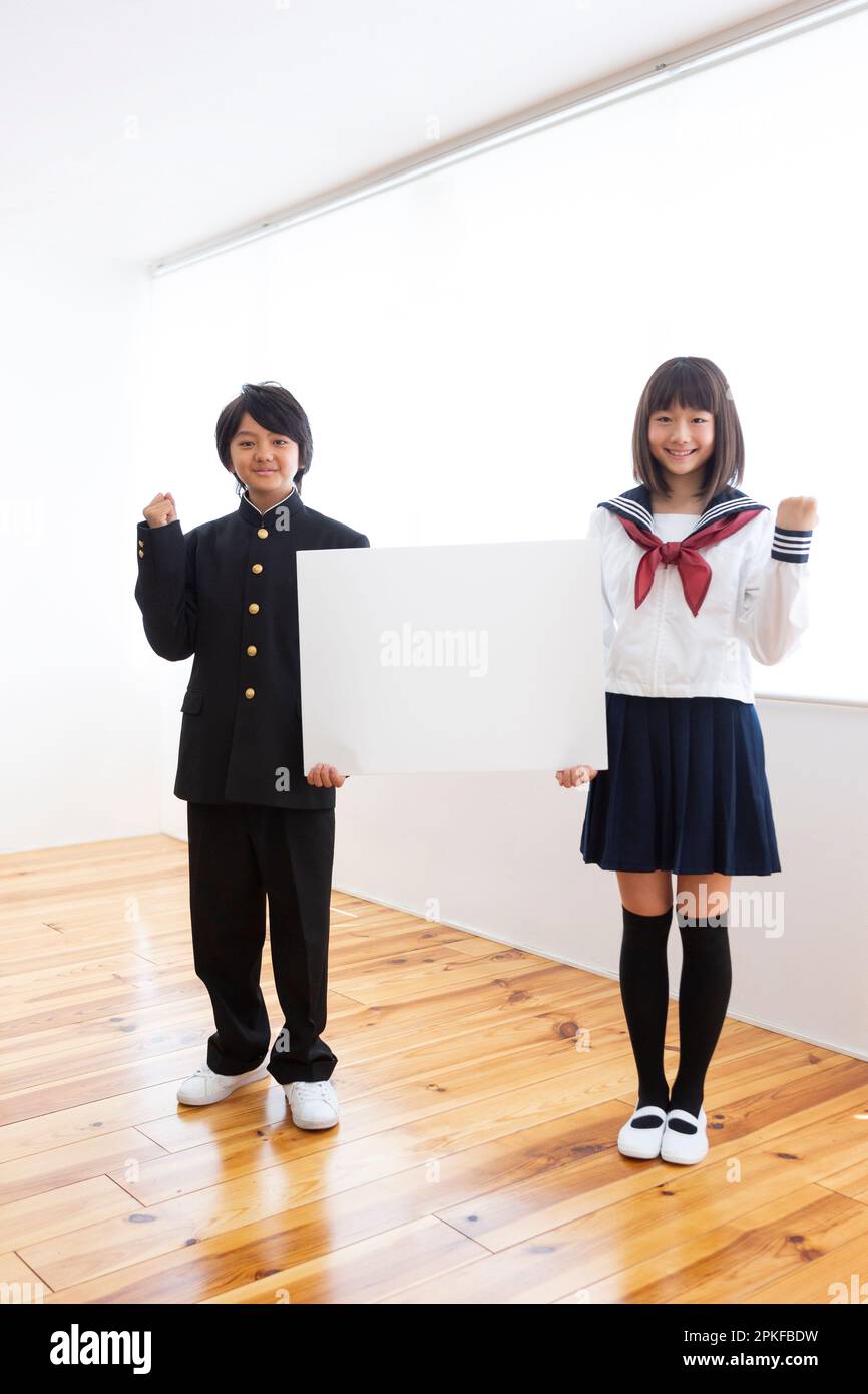 Junior high school student with board Stock Photo - Alamy