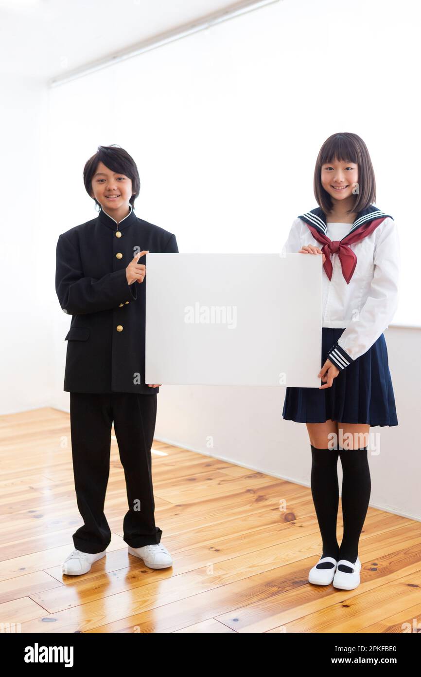 Junior high school students with boards Stock Photo - Alamy