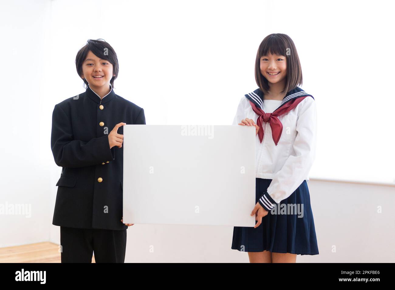 Junior high school students with boards Stock Photo - Alamy