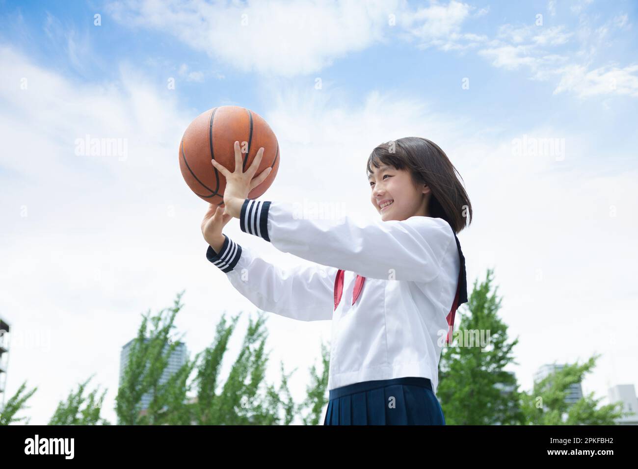 Junior high school student with a basketball Stock Photo - Alamy