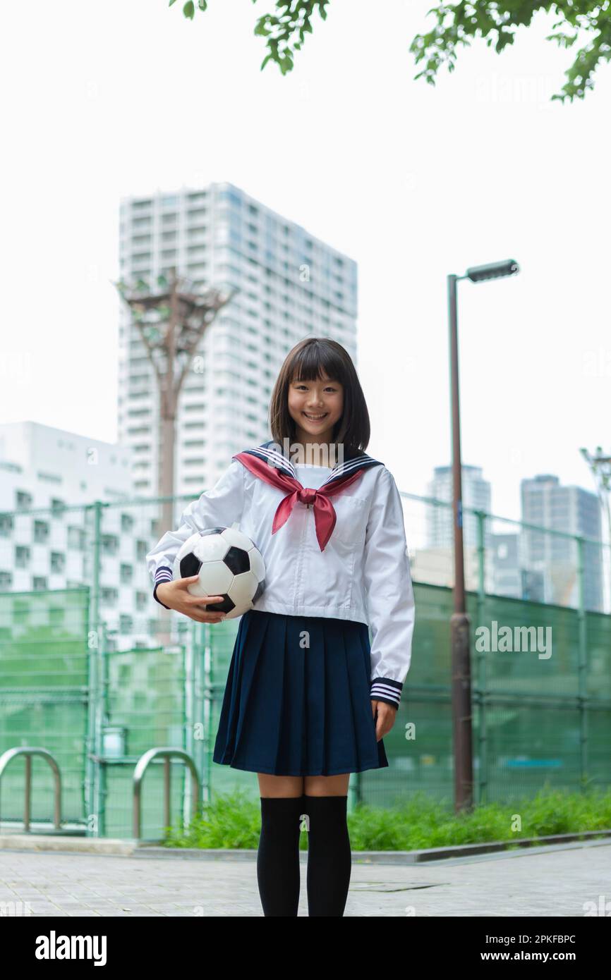 Junior high school student with soccer ball Stock Photo - Alamy