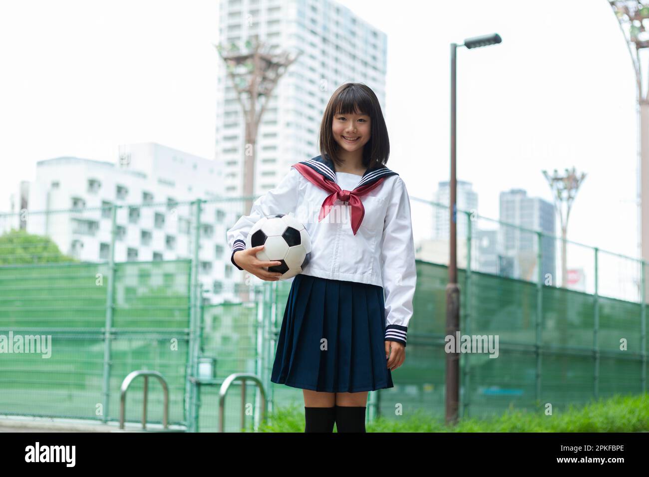 Junior high school student with a soccer ball Stock Photo - Alamy