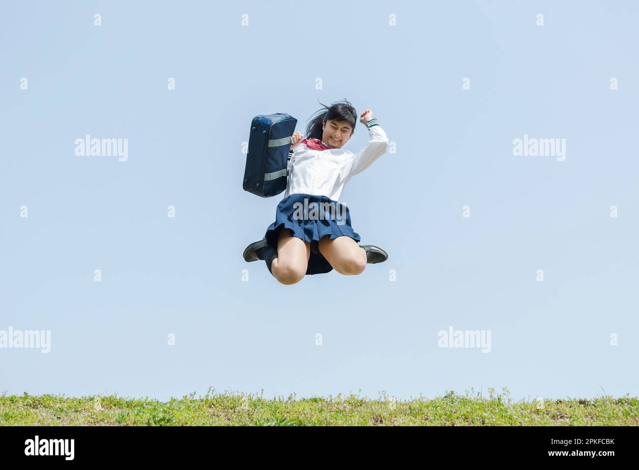 Junior high school girl jumping hi-res stock photography and images - Alamy