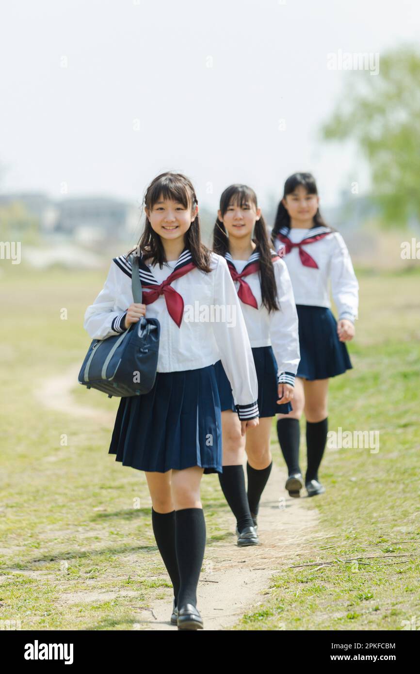 Schoolgirls walking single file Stock Photo - Alamy Schoolgirls walking single file Stock Photo - Alamy