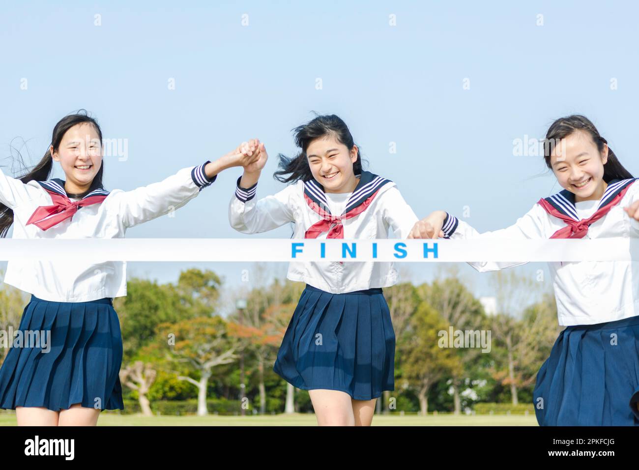 Junior high school girl at the finish line Stock Photo - Alamy