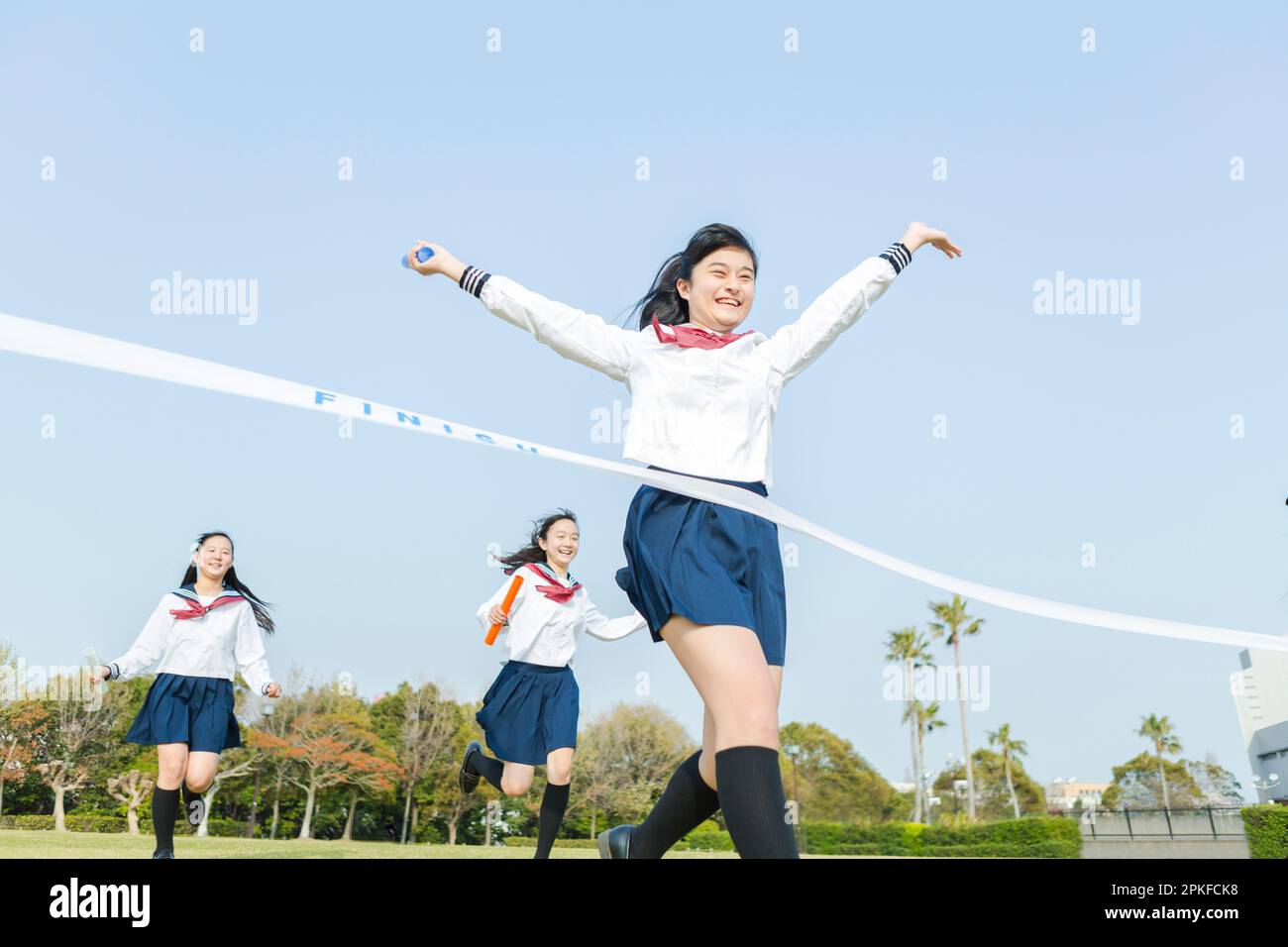 Junior high school girls at the finish line Stock Photo - Alamy