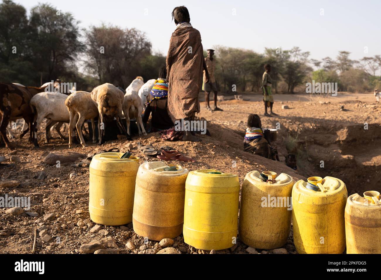 Kenya. 18th Feb, 2023. A woman of Turkana tribe giving water to her ...