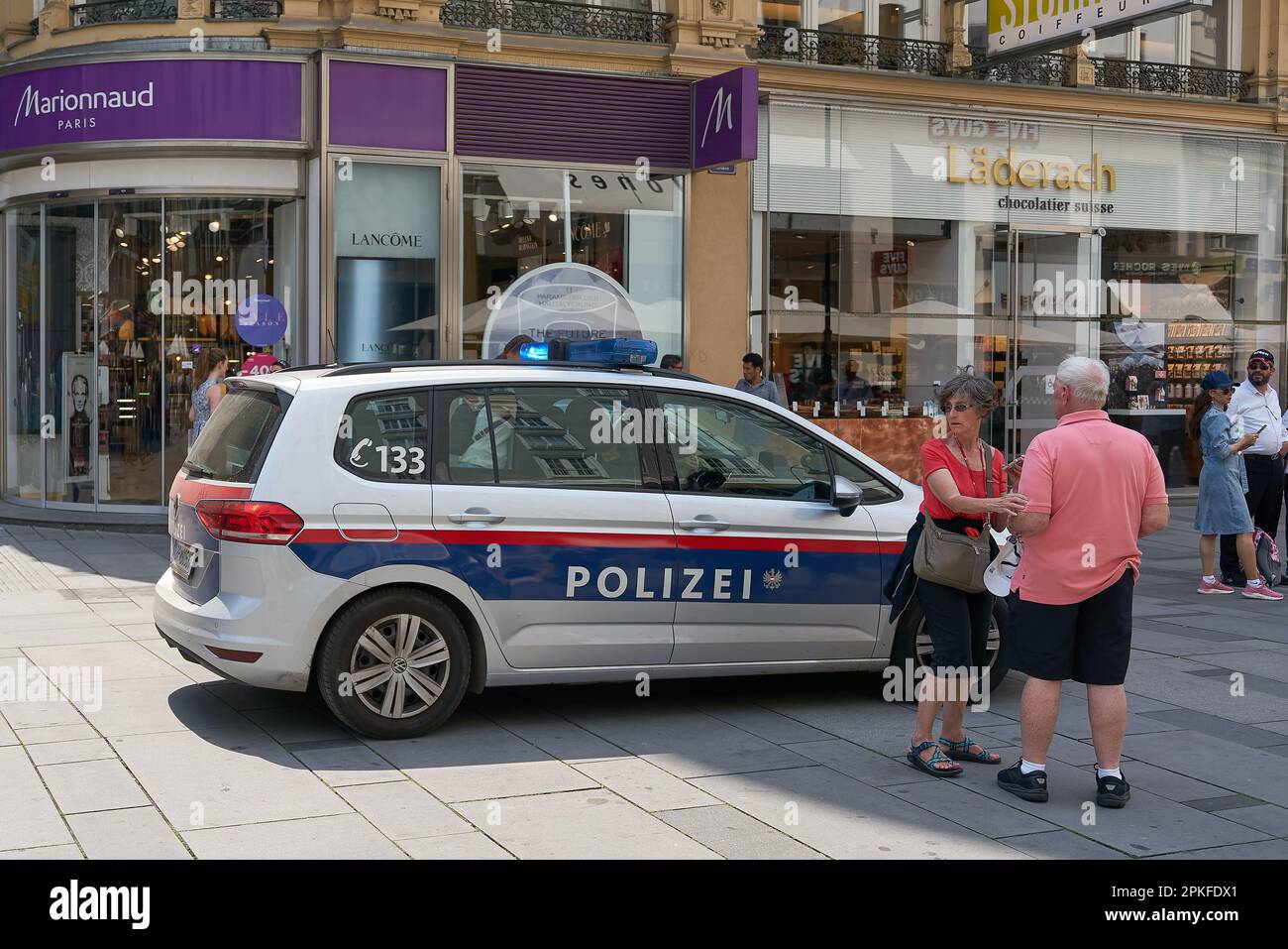 Police car during a police operation in a shopping street in the center ...