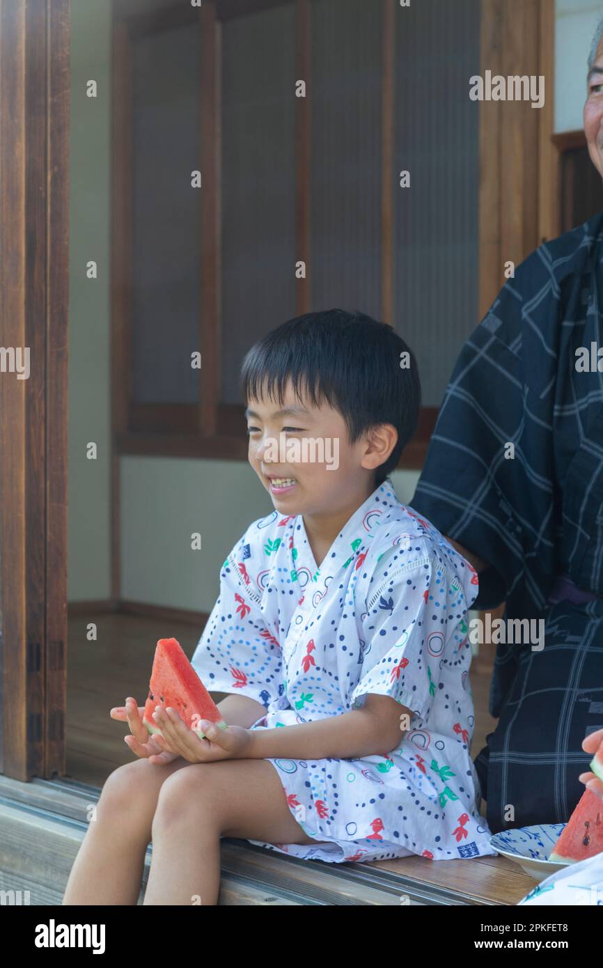 Boy sitting on the porch Stock Photo - Alamy