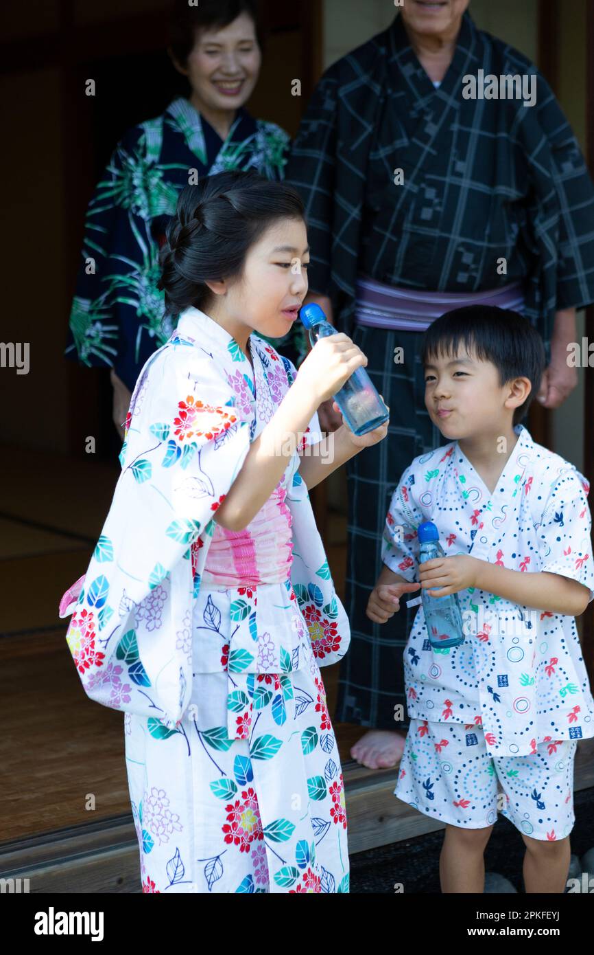 Sister and brother drinking soda pop Stock Photo - Alamy