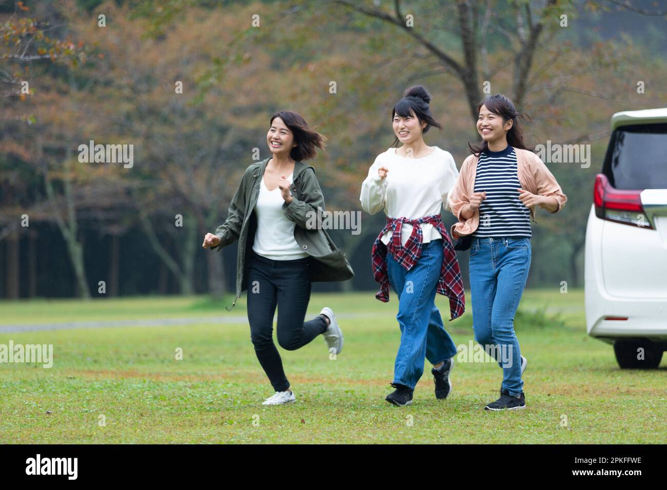 Woman Running Out Stock Photo - Alamy