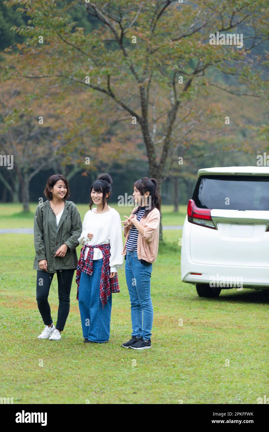 Woman standing in front of car hi-res stock photography and images - Alamy