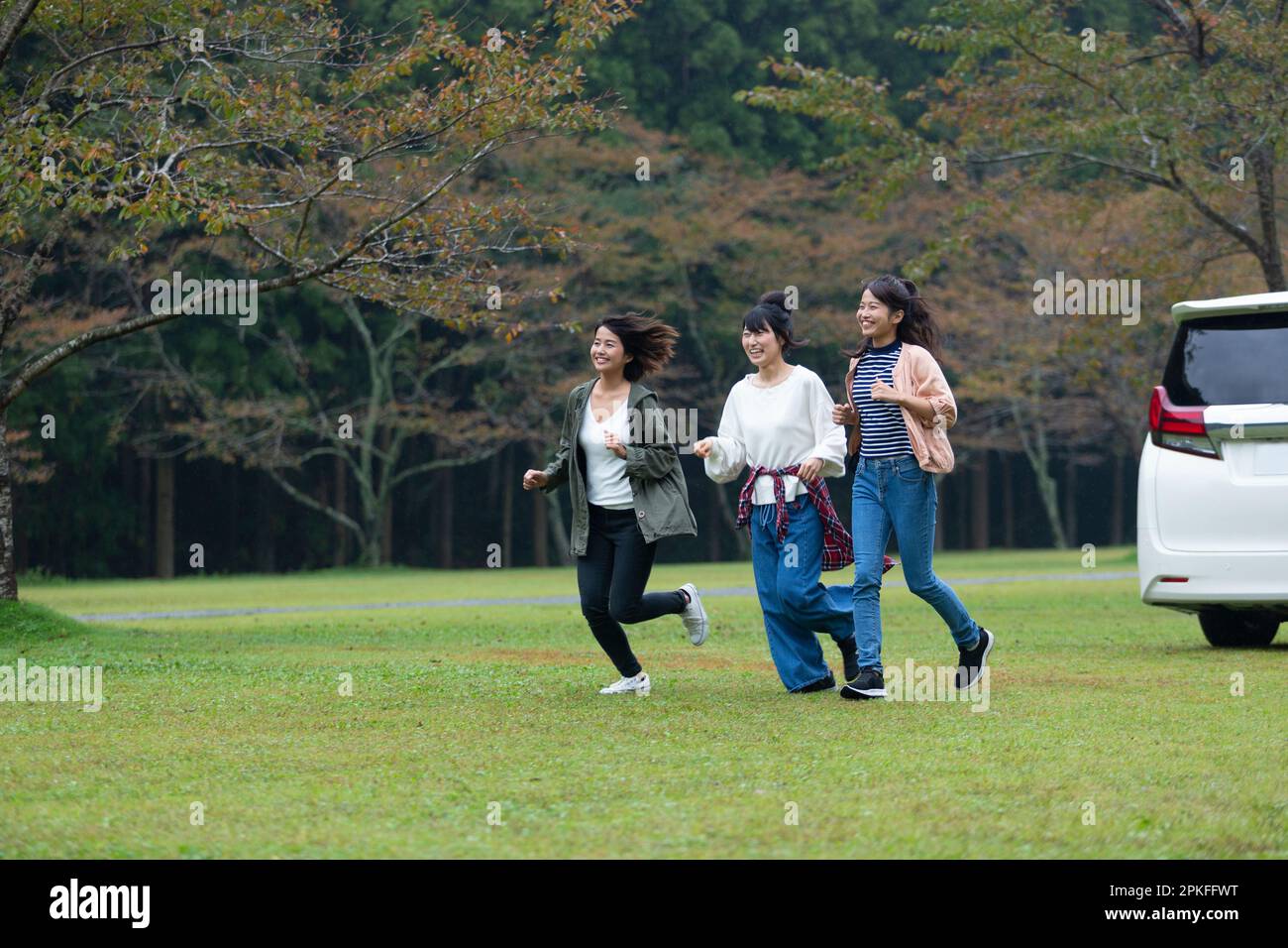 Three people running up hi-res stock photography and images - Alamy