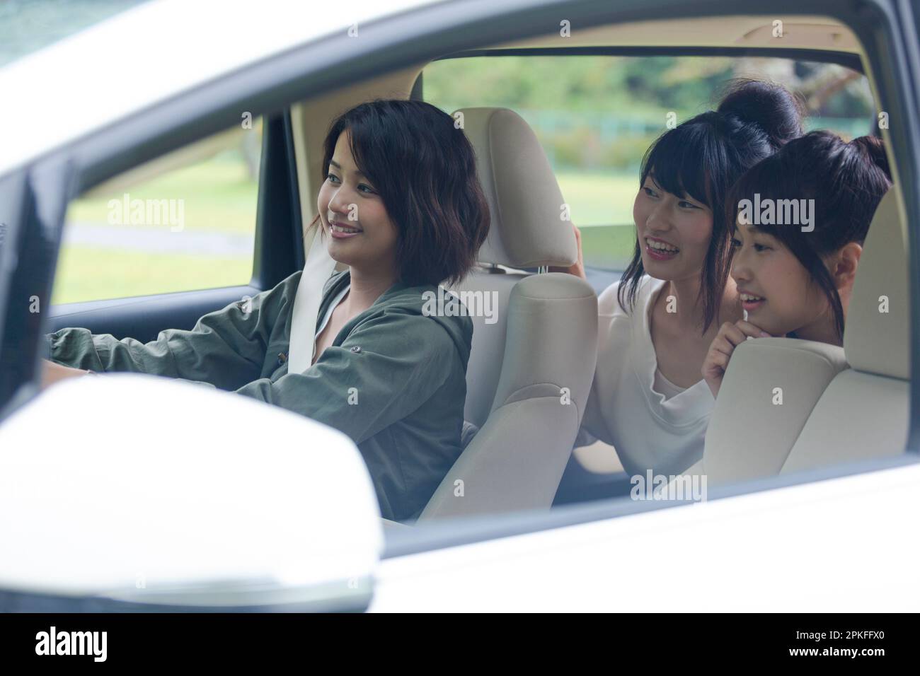Woman driving car speaking hi-res stock photography and images - Alamy