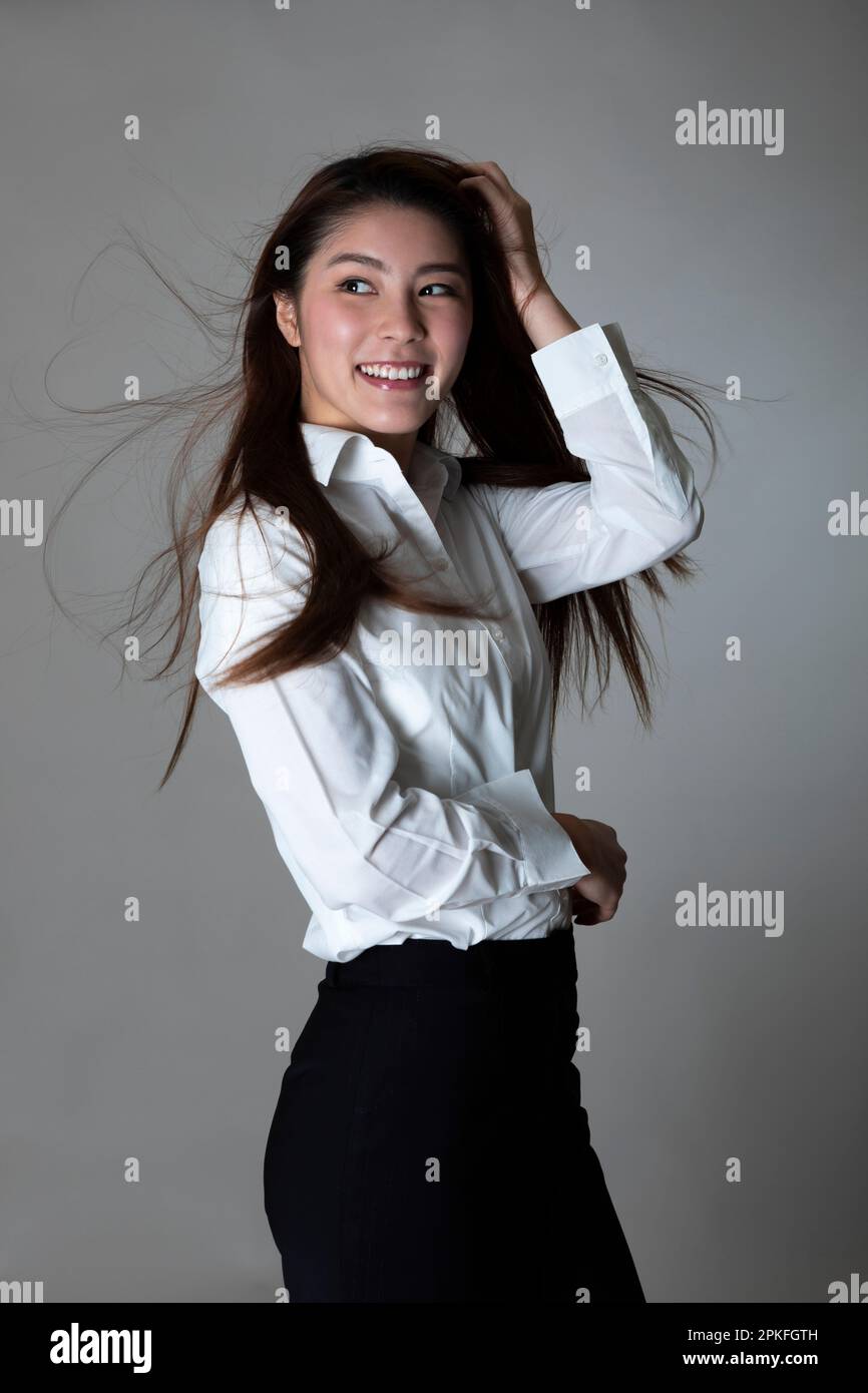 Portrait Of Woman In White Shirt Stock Photo - Alamy