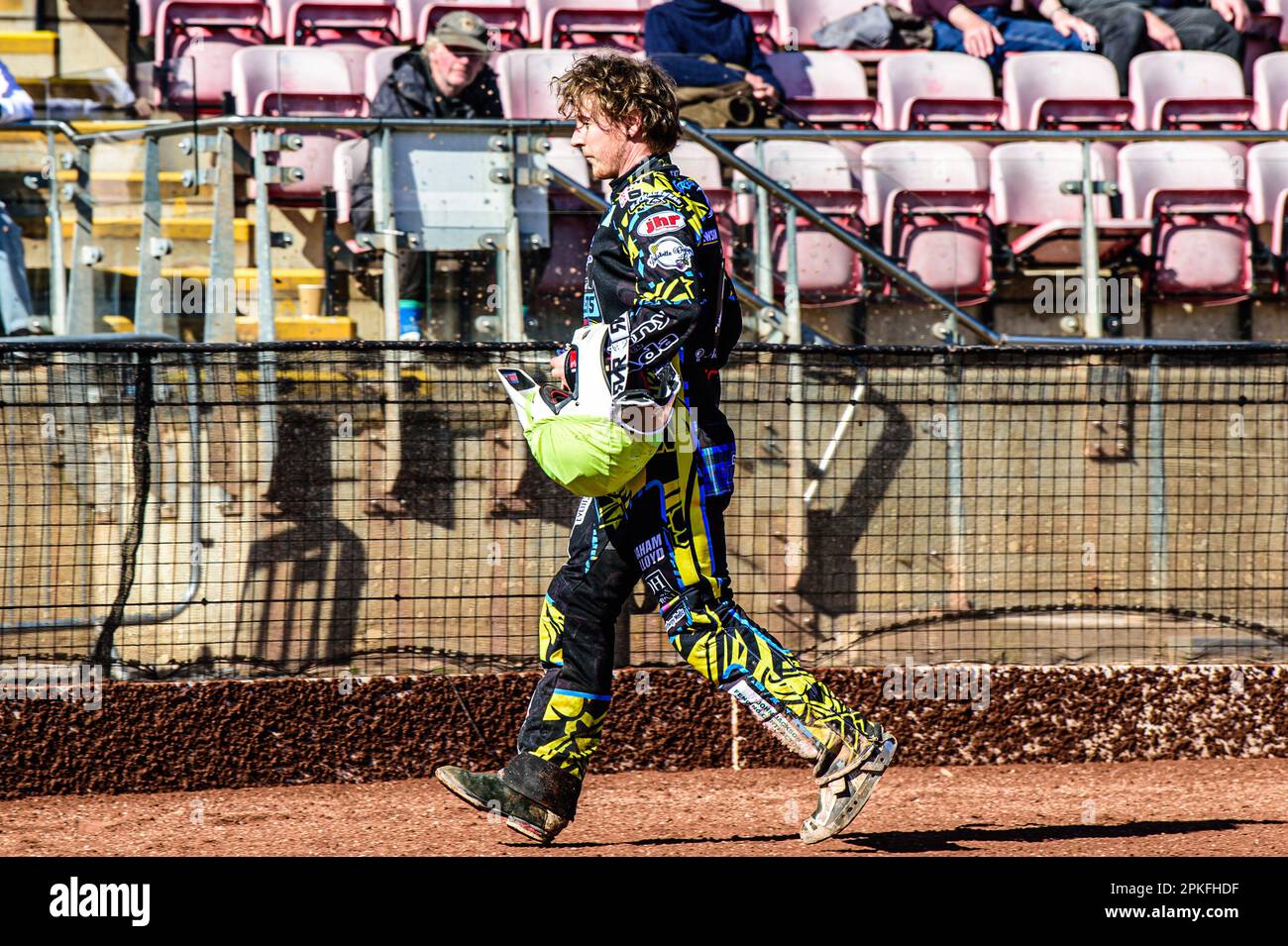 Greg Blair runs back to the pits after his machine breakdown during the ...