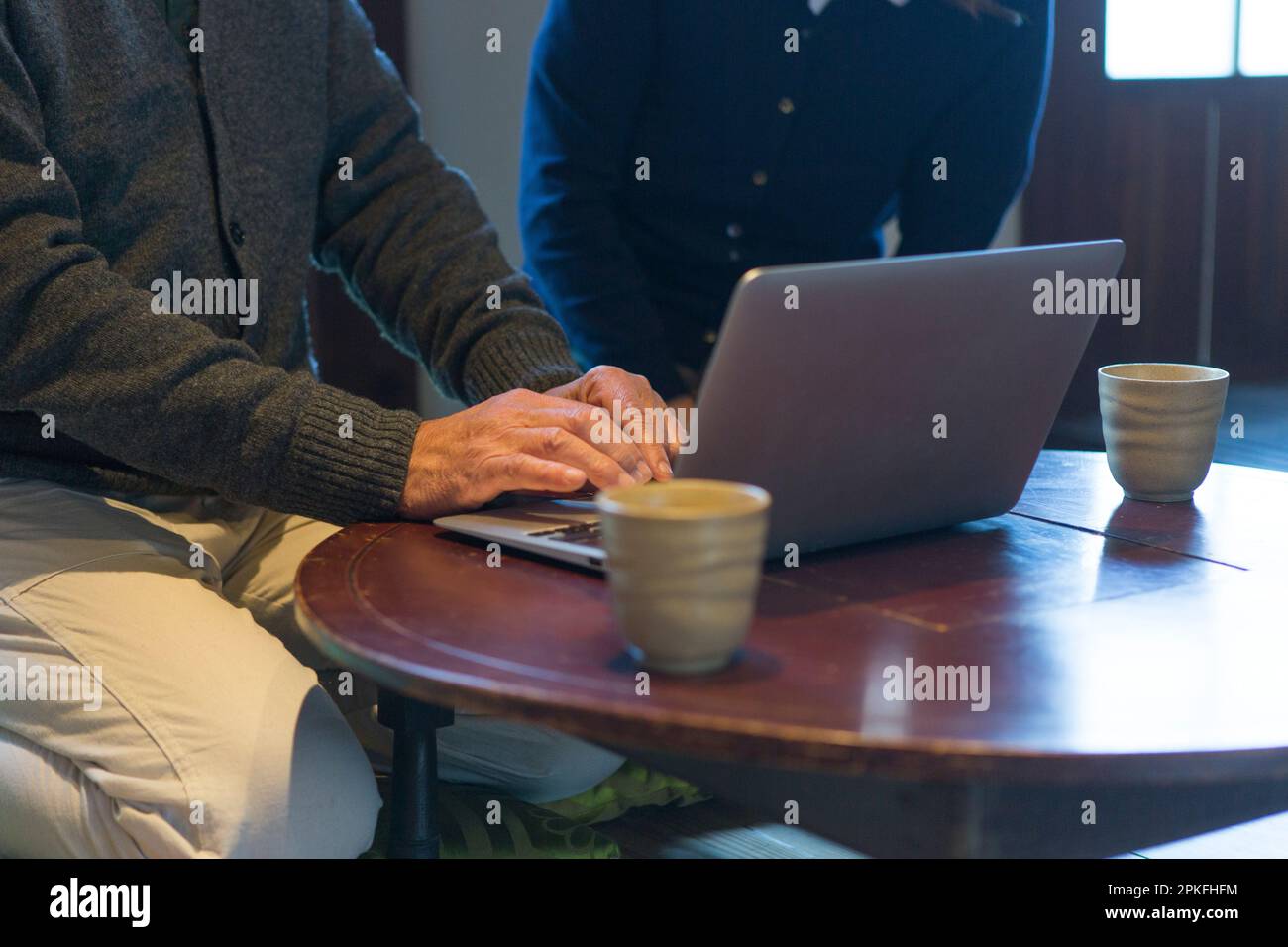 A senior couple looking something up on the computer Stock Photo - Alamy