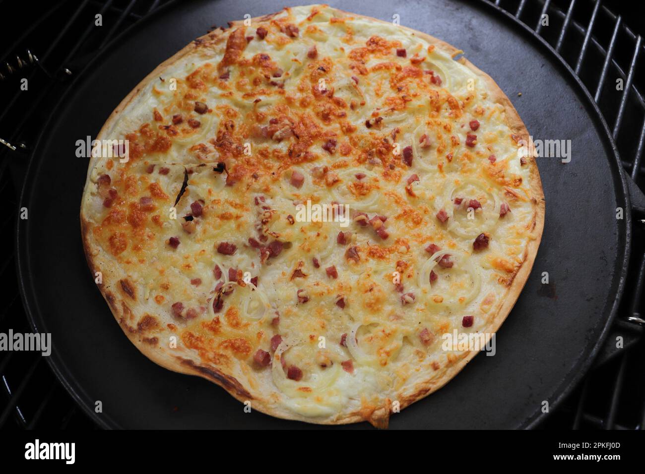 Tarte flambee fresh from the oven Stock Photo - Alamy