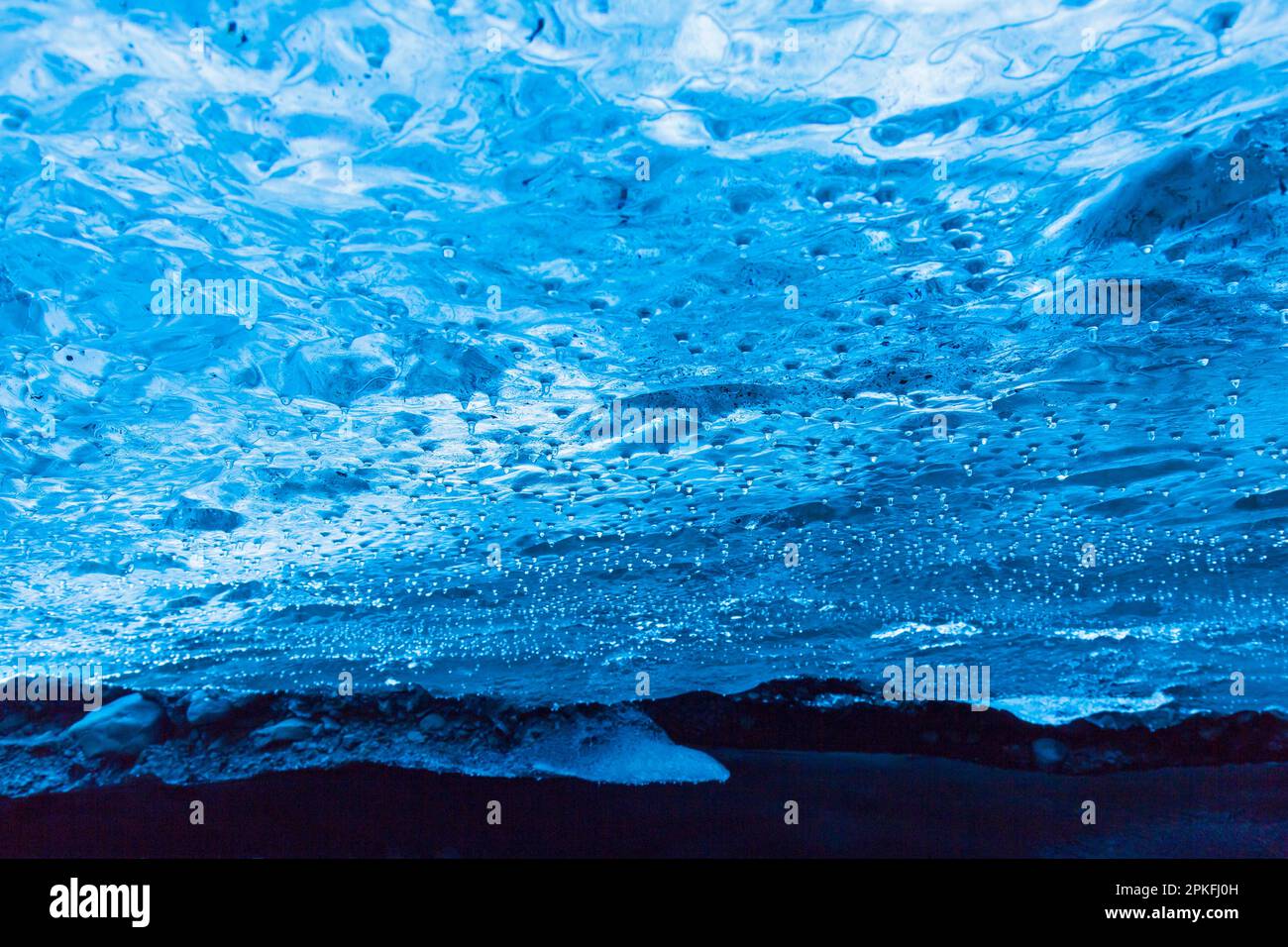 Droplets, water dripping from ceiling inside natural ice cave in ...