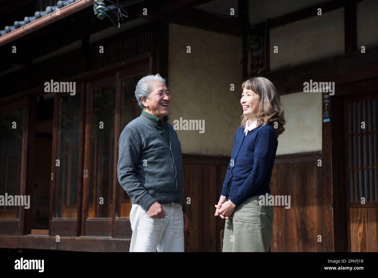 Old couple talking standing in hi-res stock photography and images - Alamy