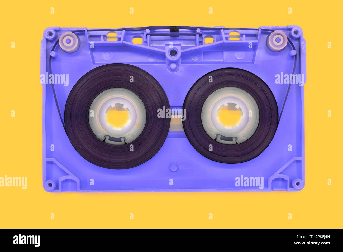 blue old audio cassette tape open on yellow background Stock Photo - Alamy