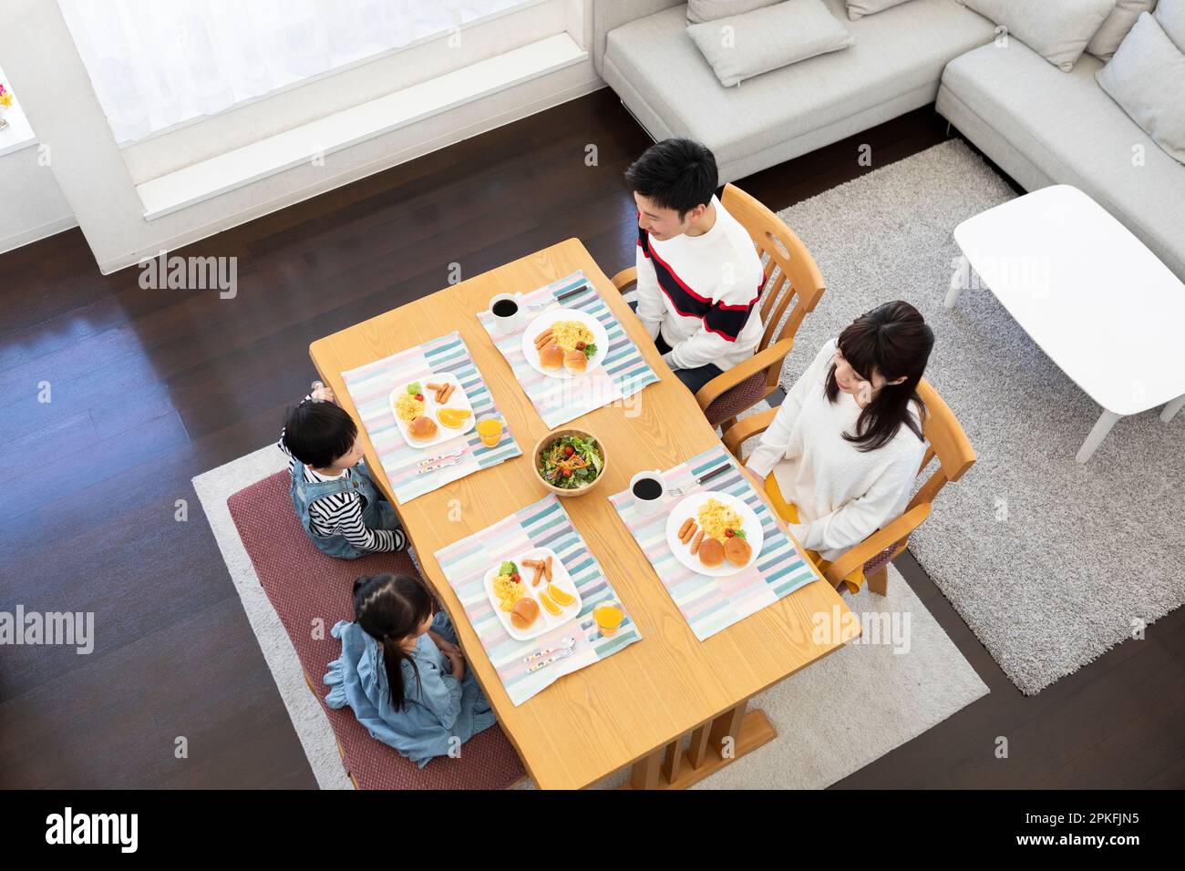 Family eating breakfast Stock Photo - Alamy