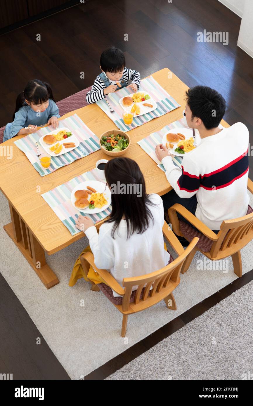 Families eating breakfast Stock Photo - Alamy