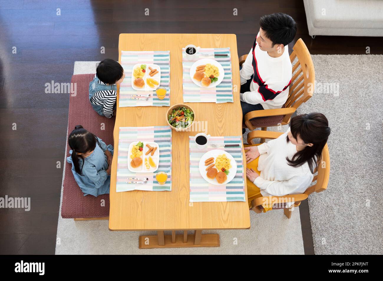 Family eating breakfast Stock Photo - Alamy