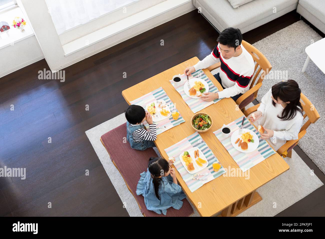 Family eating breakfast Stock Photo - Alamy