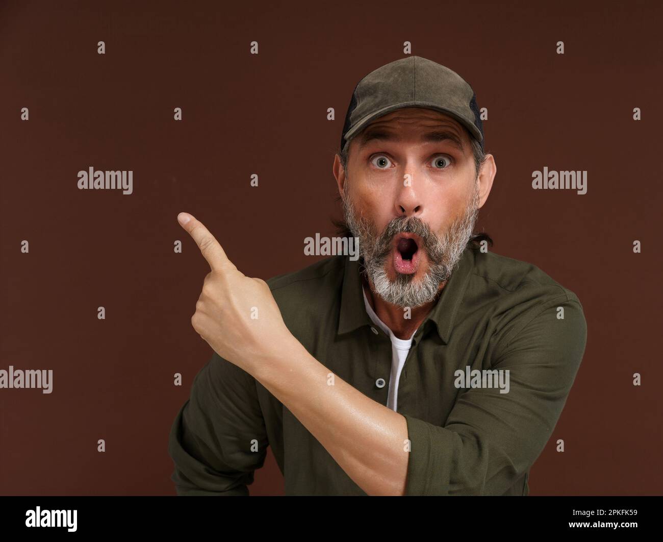 Middle-aged Caucasian country man expresses extreme surprise, pointing ...