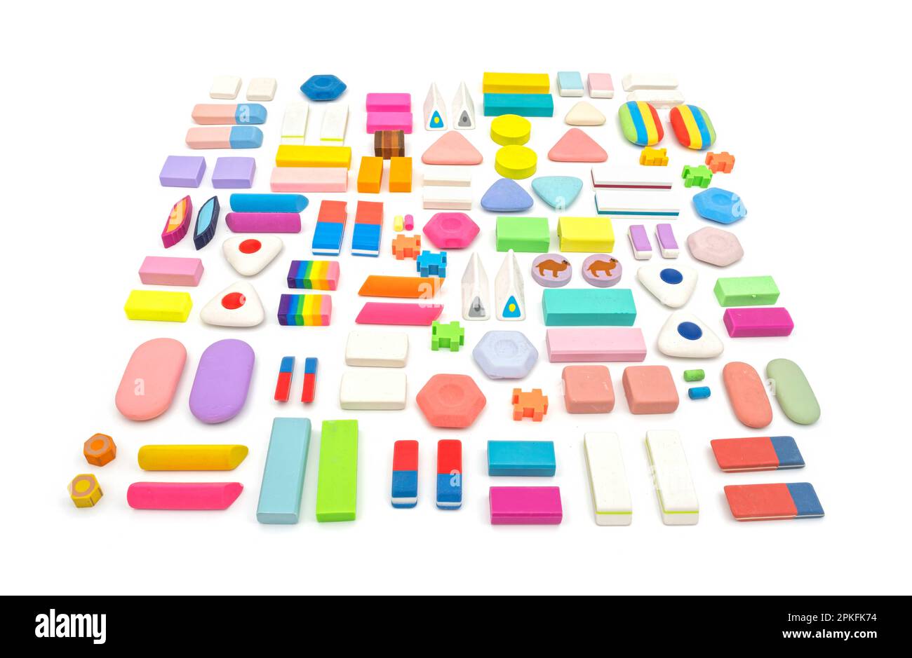 various shapes and colors of erasers arranged isolated on white ...