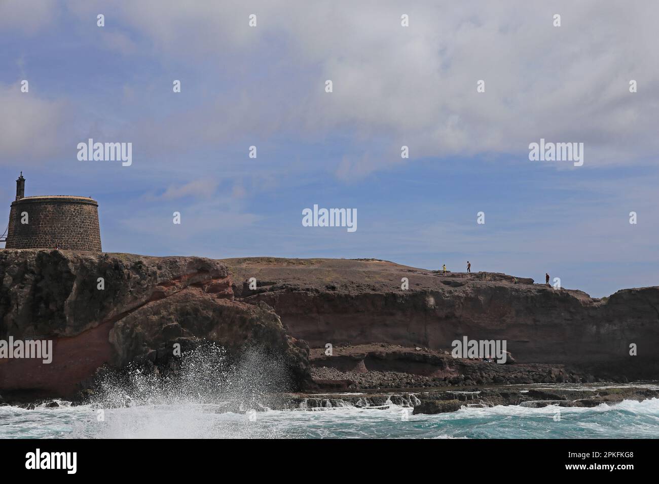 Crashing Atlantic waves, along the desolate coast at Torre Del Aguila ...