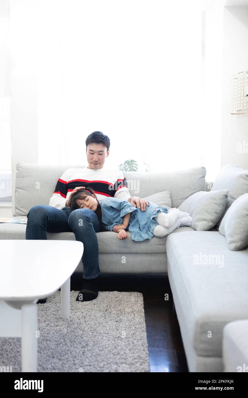 Napping Girl and Father Stock Photo - Alamy