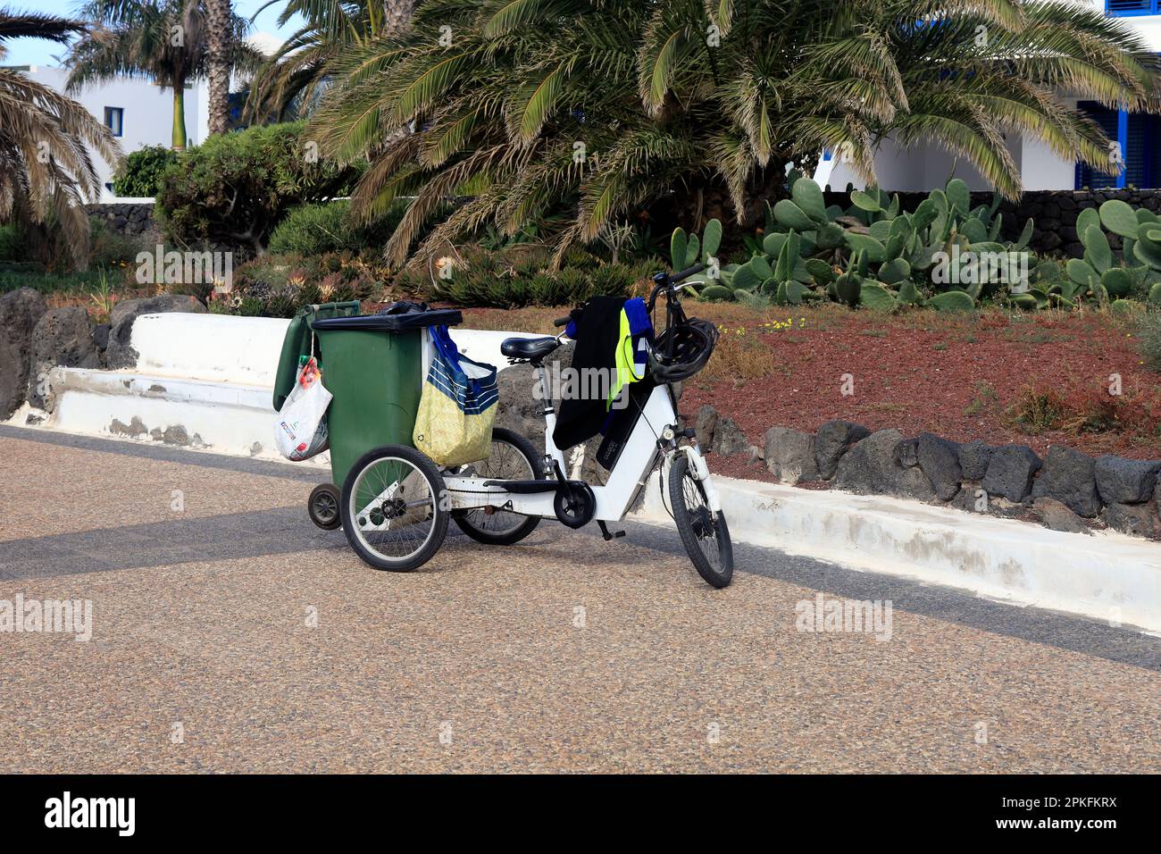 Litter collector's bicycle on the coastal path, Playa Blanca. Taken ...