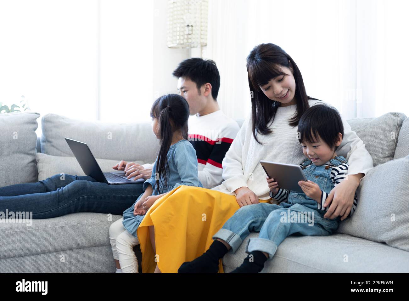Family watching computer Stock Photo - Alamy