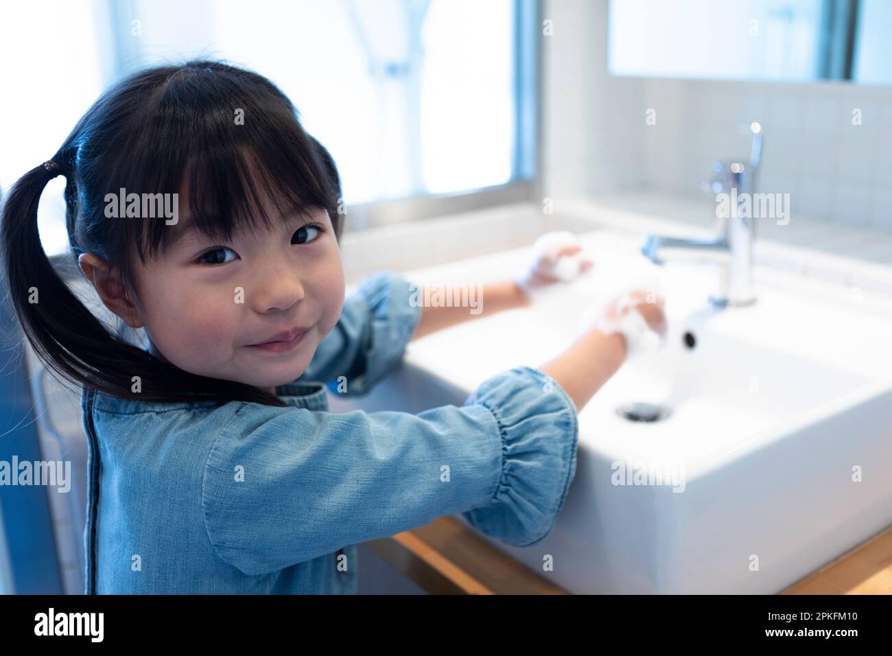 Girl Washing Hands Stock Photo - Alamy