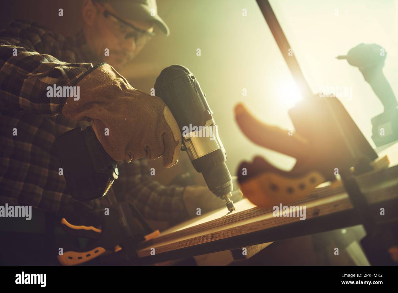 Caucasian Man and His Small Woodwork Project. Cordless Drill Driver in ...